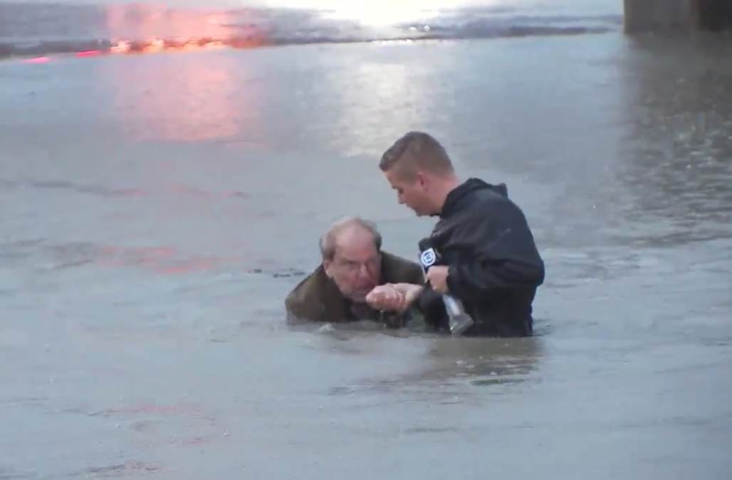 Houston TV reporter rescues driver trapped on flooded road