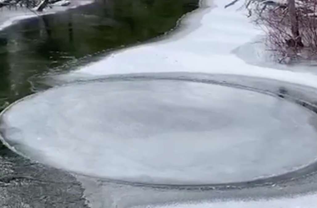 Perfect circle of ice slowly spins in middle of Michigan river in ...