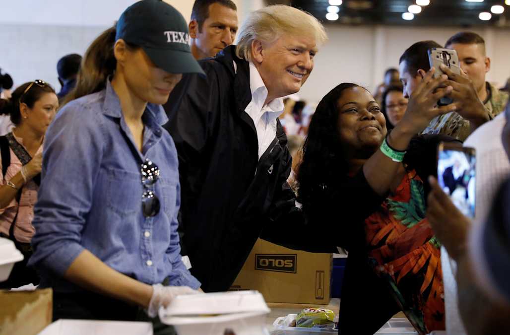 Trump hugs children, serves food in visit to victims of Harvey